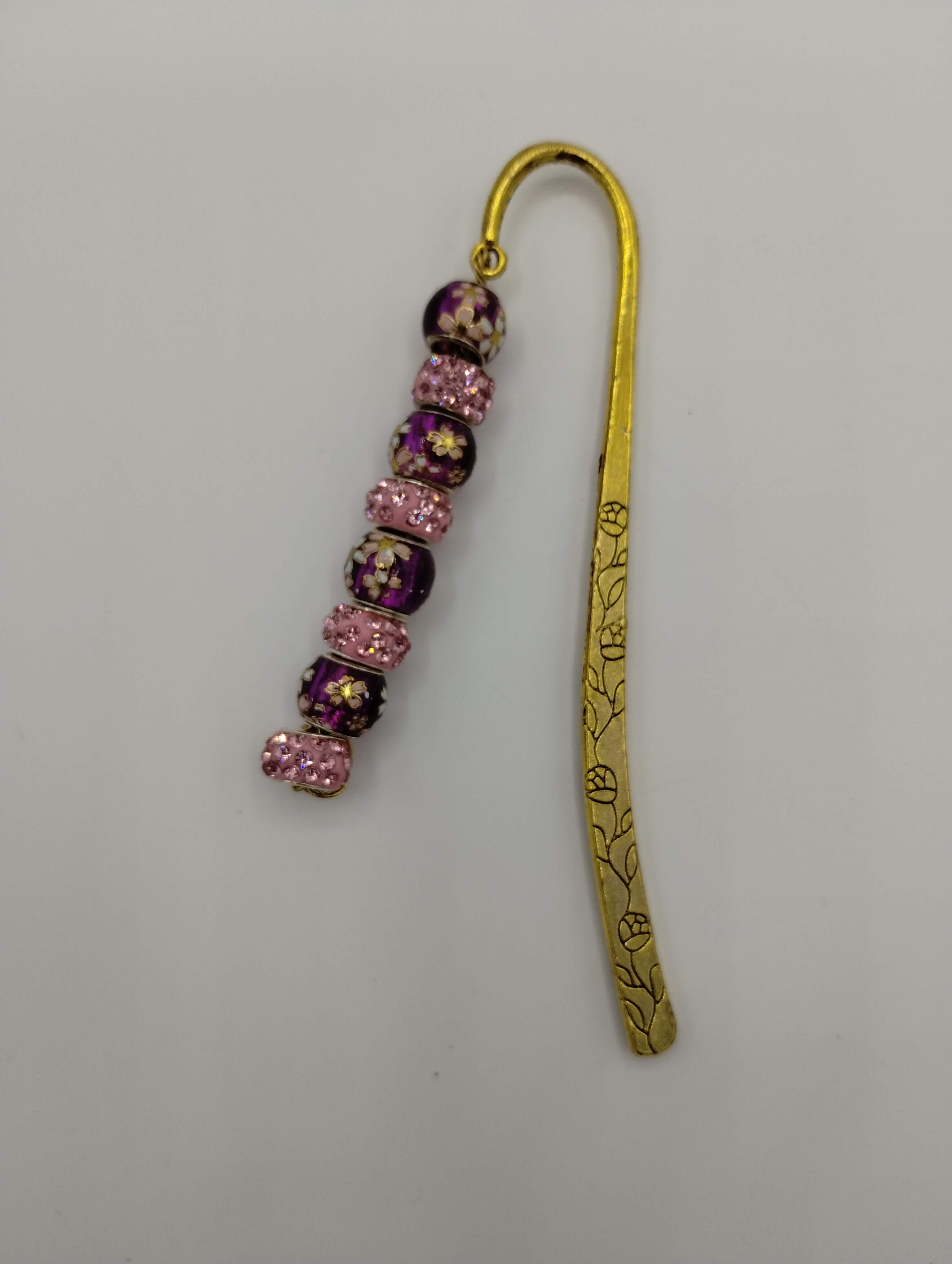 Purple and pink beaded book marker.